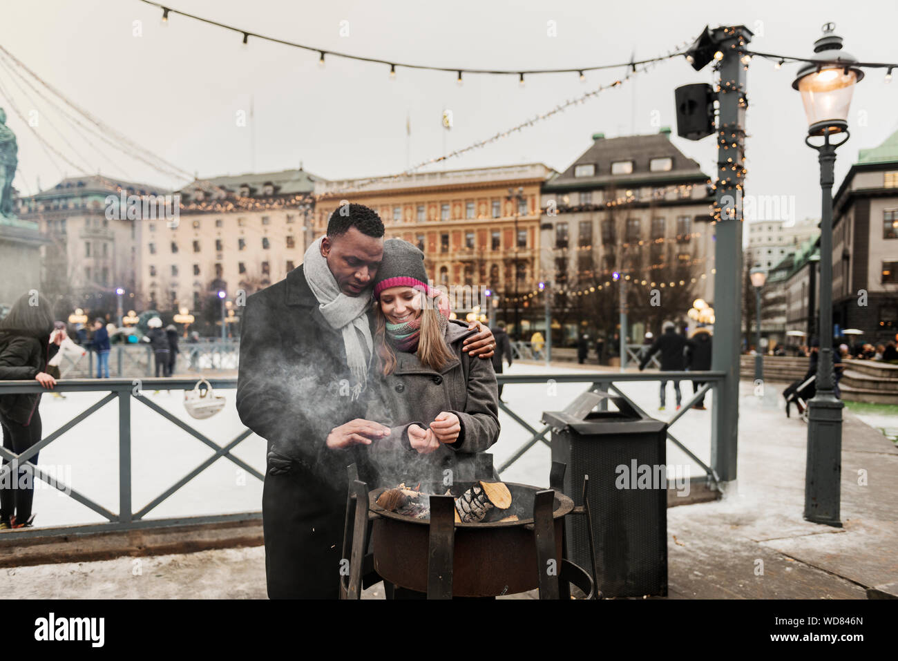 People warming in winter with fire hi-res stock photography and images ...
