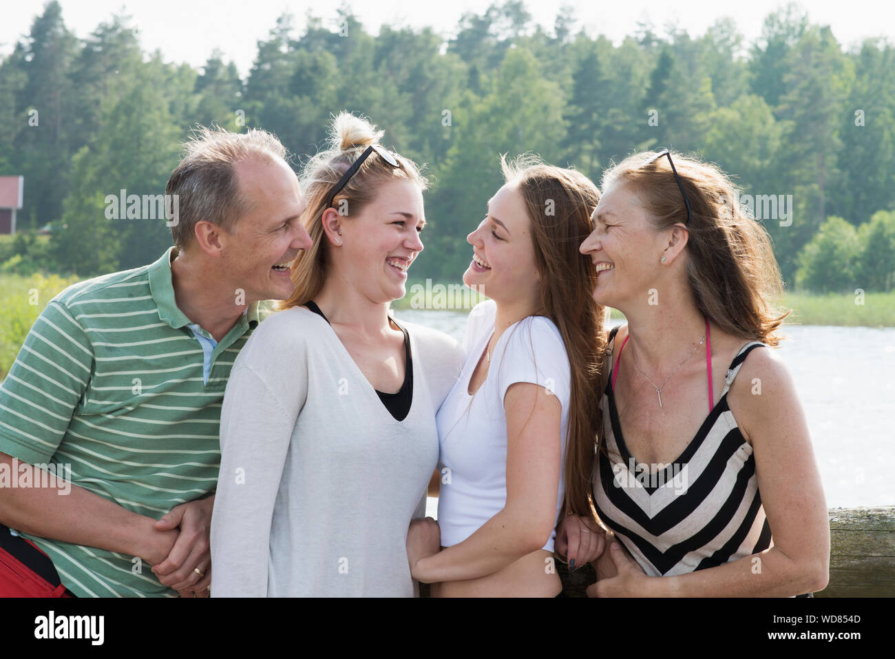 Smiling family hi-res stock photography and images - Alamy