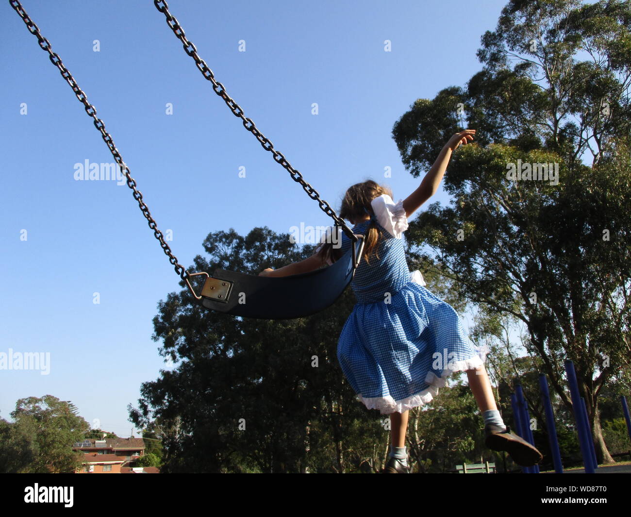 Girl swing rear view hi-res stock photography and images - Alamy