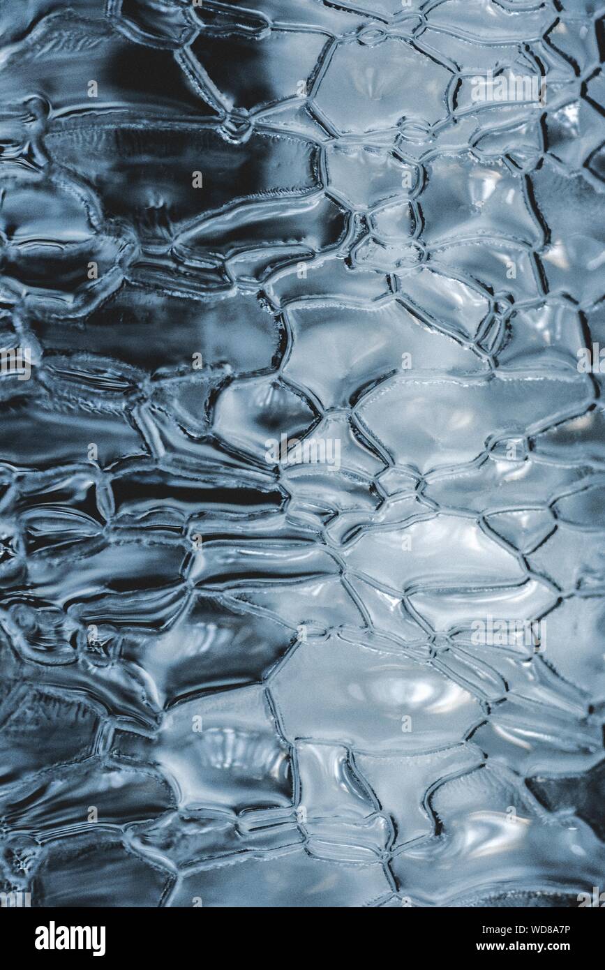 Vertical closeup shot of a cracked ice Stock Photo - Alamy