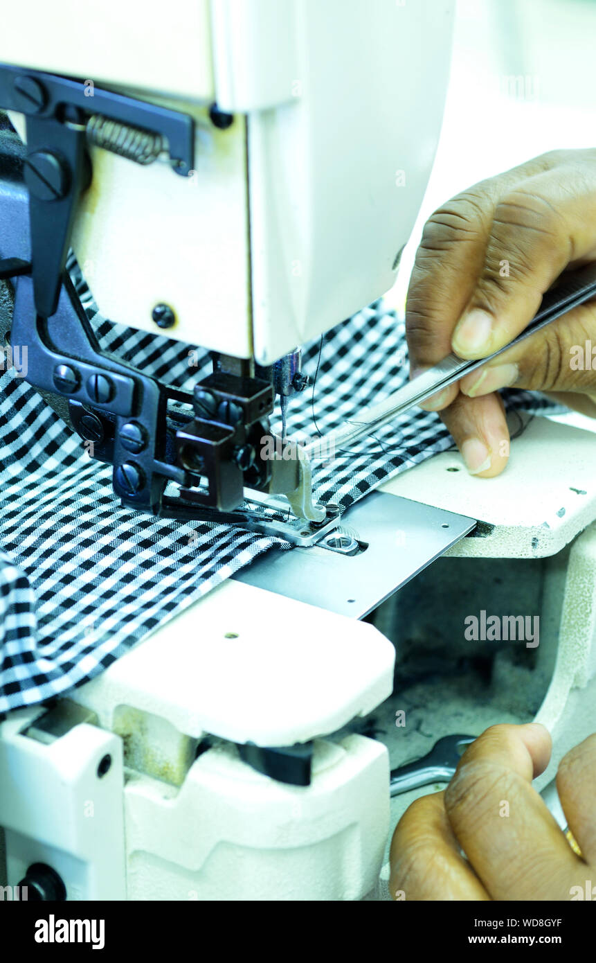 Employee making school uniforms Stock Photo - Alamy
