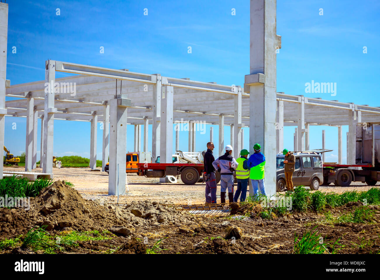 Team of civil engineers is making decision at work site discussing ...