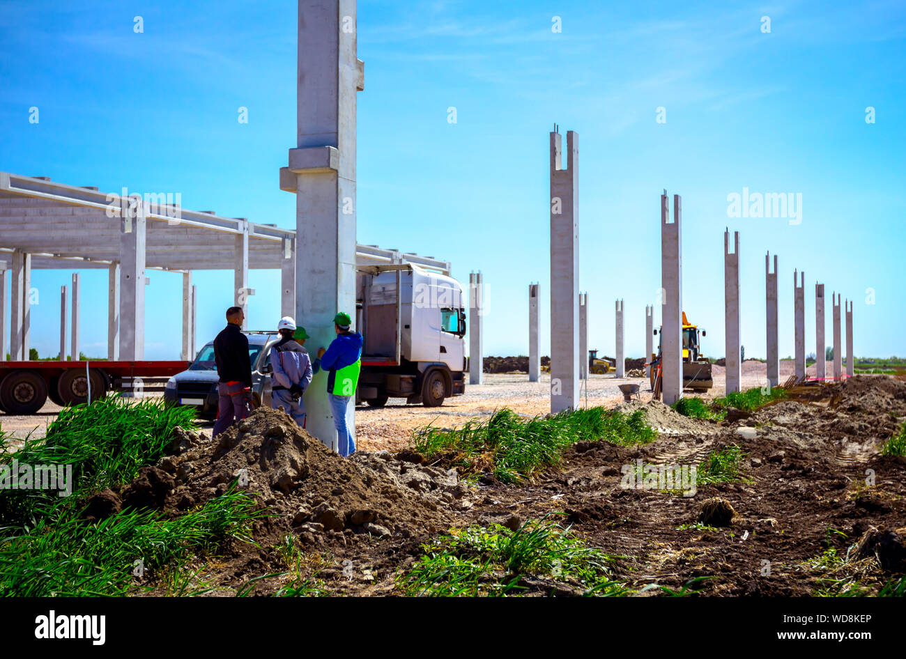 Team of civil engineers is making decision at work site discussing ...
