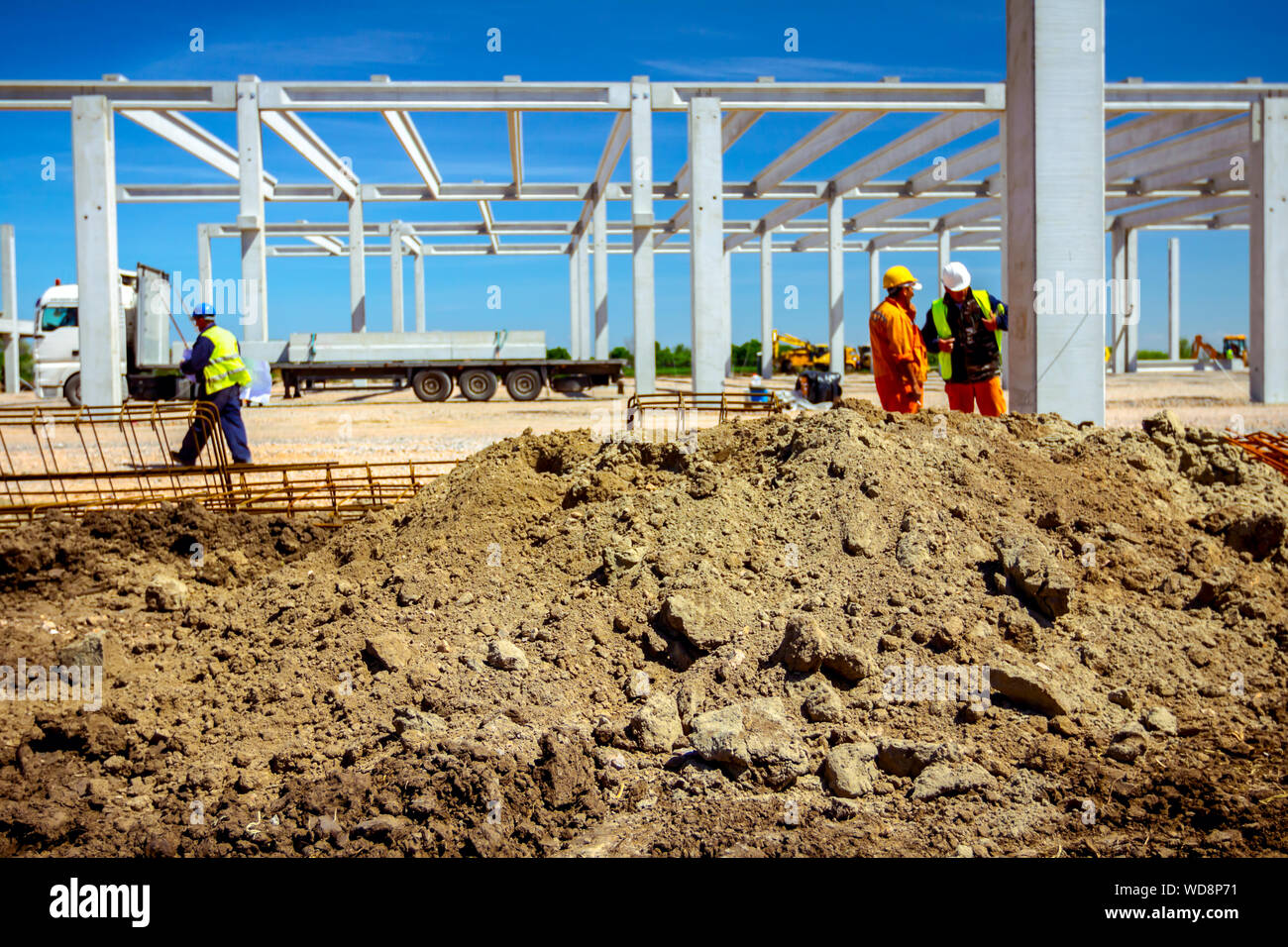 Team of civil engineers is making decision at work site discussing ...