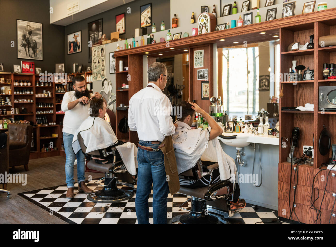 Barbers cutting hair hi-res stock photography and images - Alamy