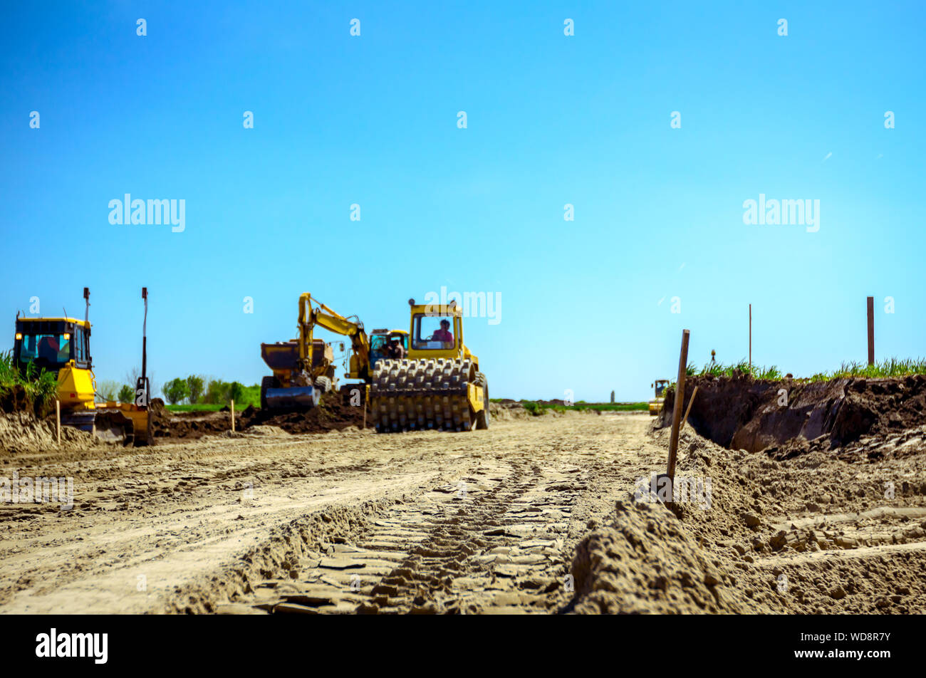 Trace of huge construction machine in sandy ground at construction site ...