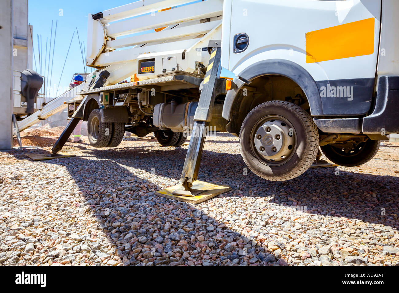 Truck with extended side outrigger stabilizer give support to mobile ...