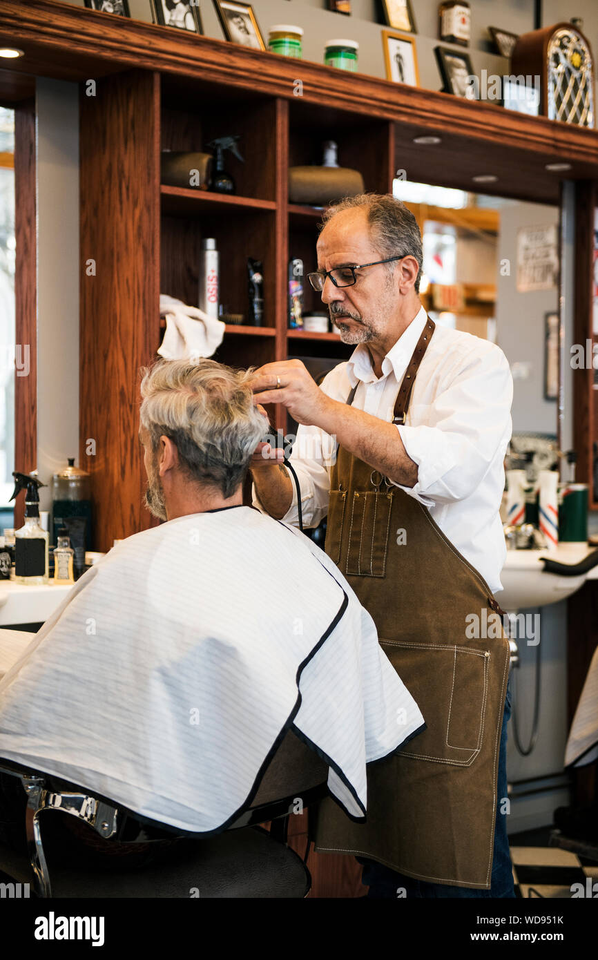 Barber cutting hair customer hi-res stock photography and images - Alamy