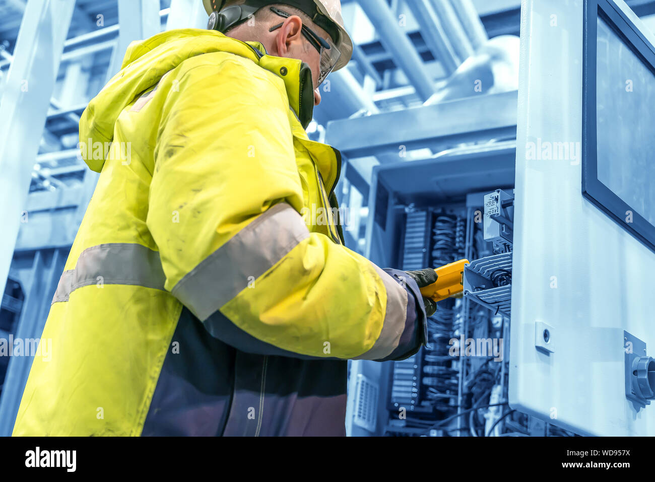 technical engineer performs a measurement in a control cabinet Stock ...