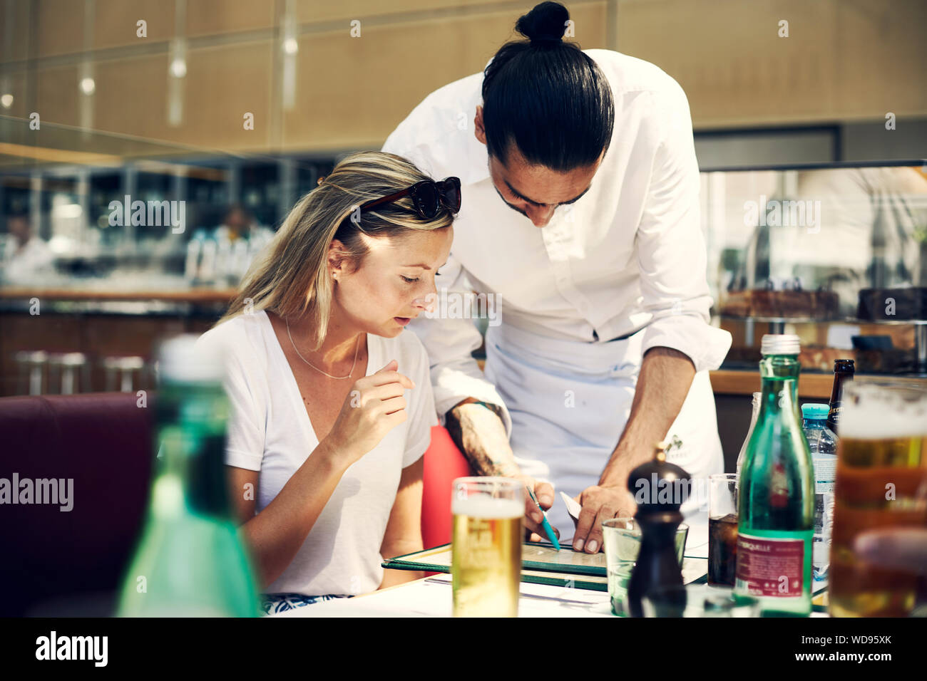 Woman in restaurant and menu hi-res stock photography and images - Alamy