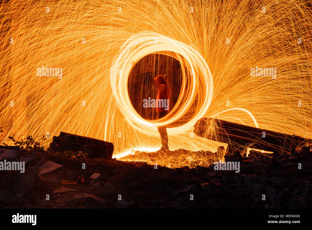 Drawing light at night in an old abandoned building, splashes of light ...