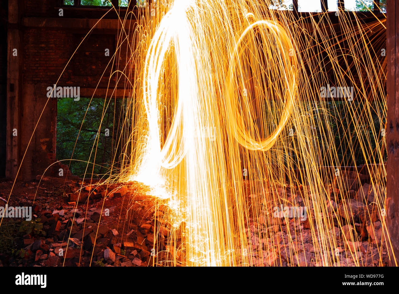 Drawing light at night in an old abandoned building, splashes of light ...