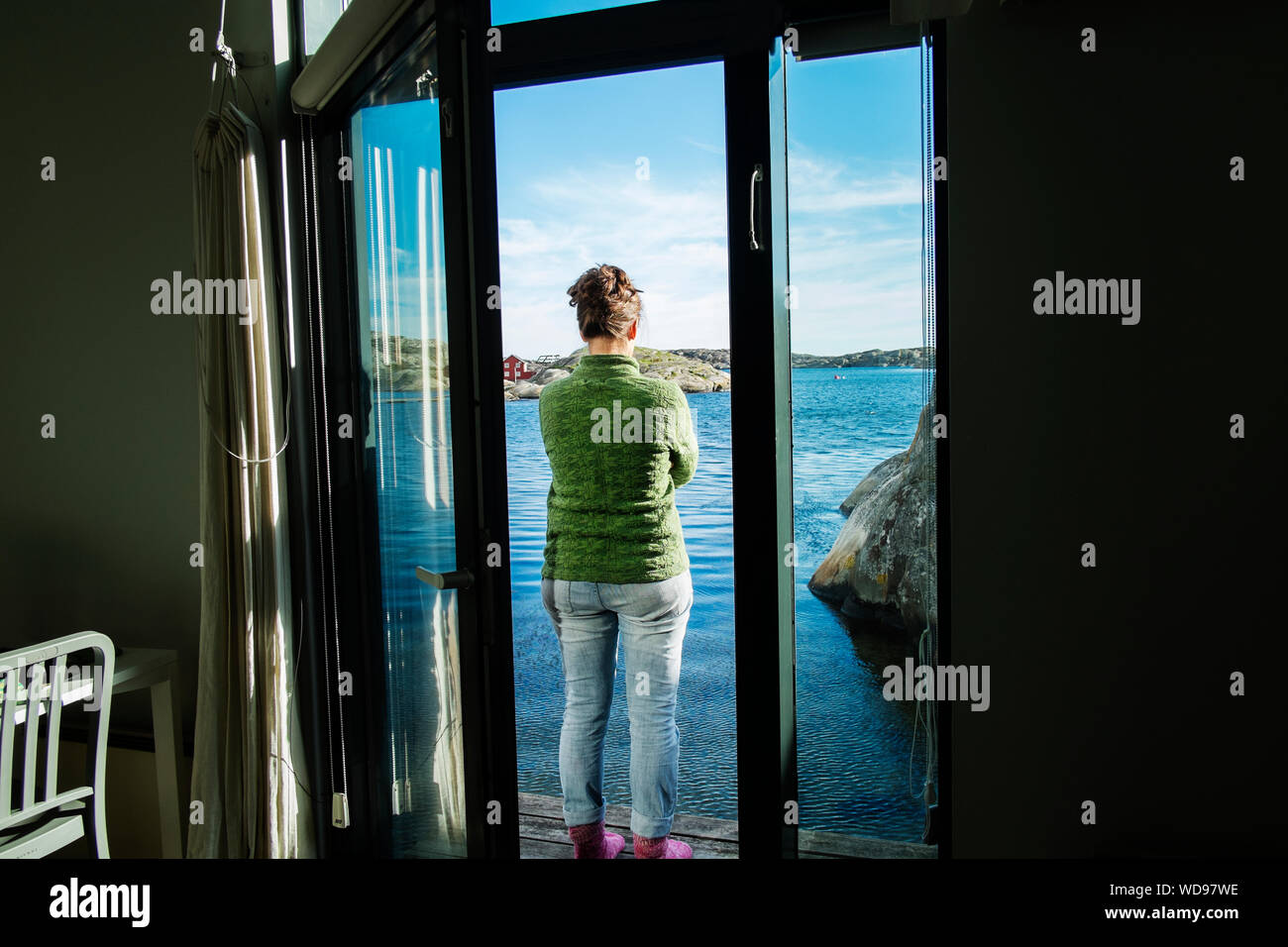Woman balcony sea hi-res stock photography and images - Alamy