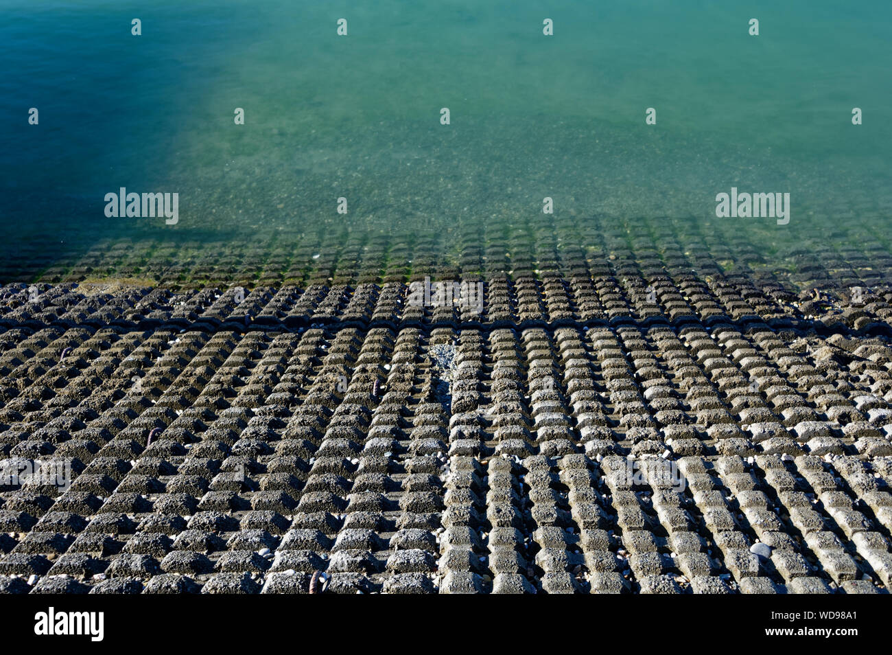 A coastal bank is stabilised using corrugated concrete Stock Photo - Alamy