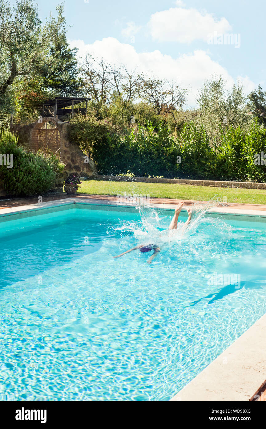 Woman diving into pool hi-res stock photography and images - Alamy