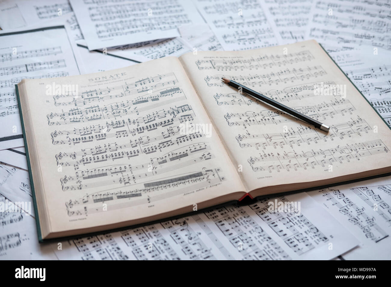 Music book ,sheet music score and pencil Stock Photo - Alamy