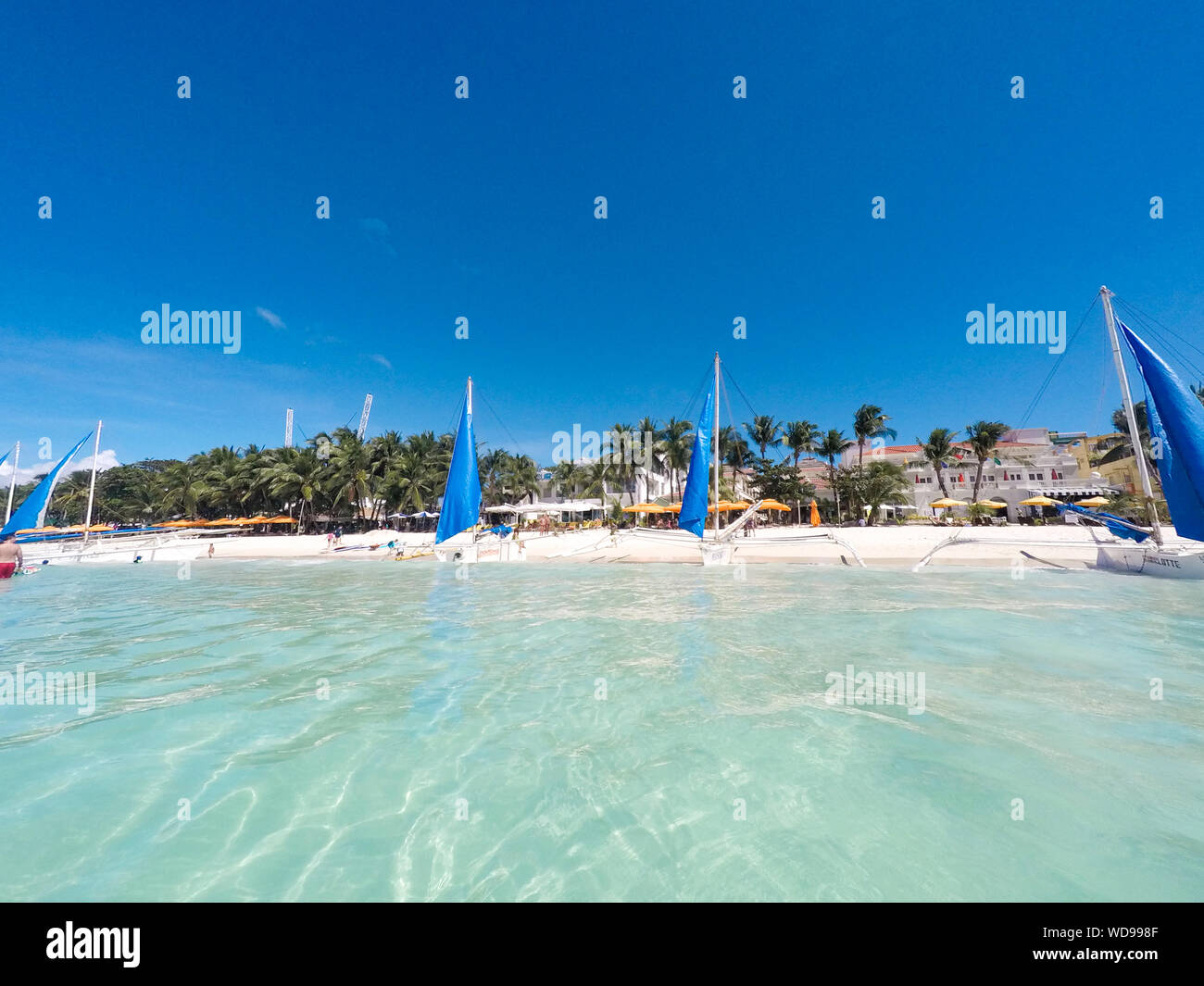 White beaches of Boracay Philippines. Turquoise sea. Green palm trees ...