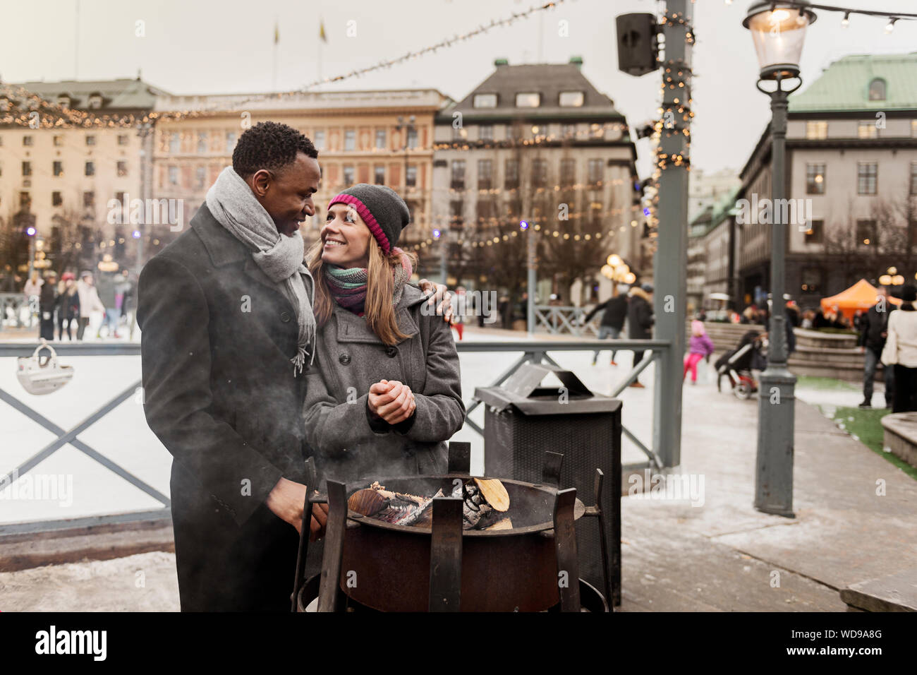 People warming in winter with fire hi-res stock photography and images ...