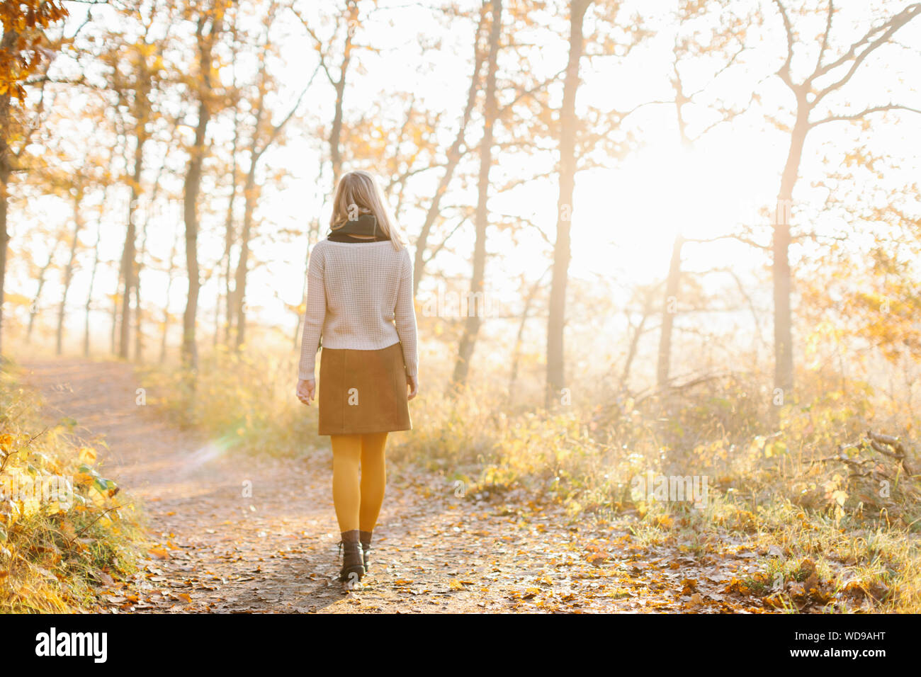 Woman walking away hi-res stock photography and images - Alamy