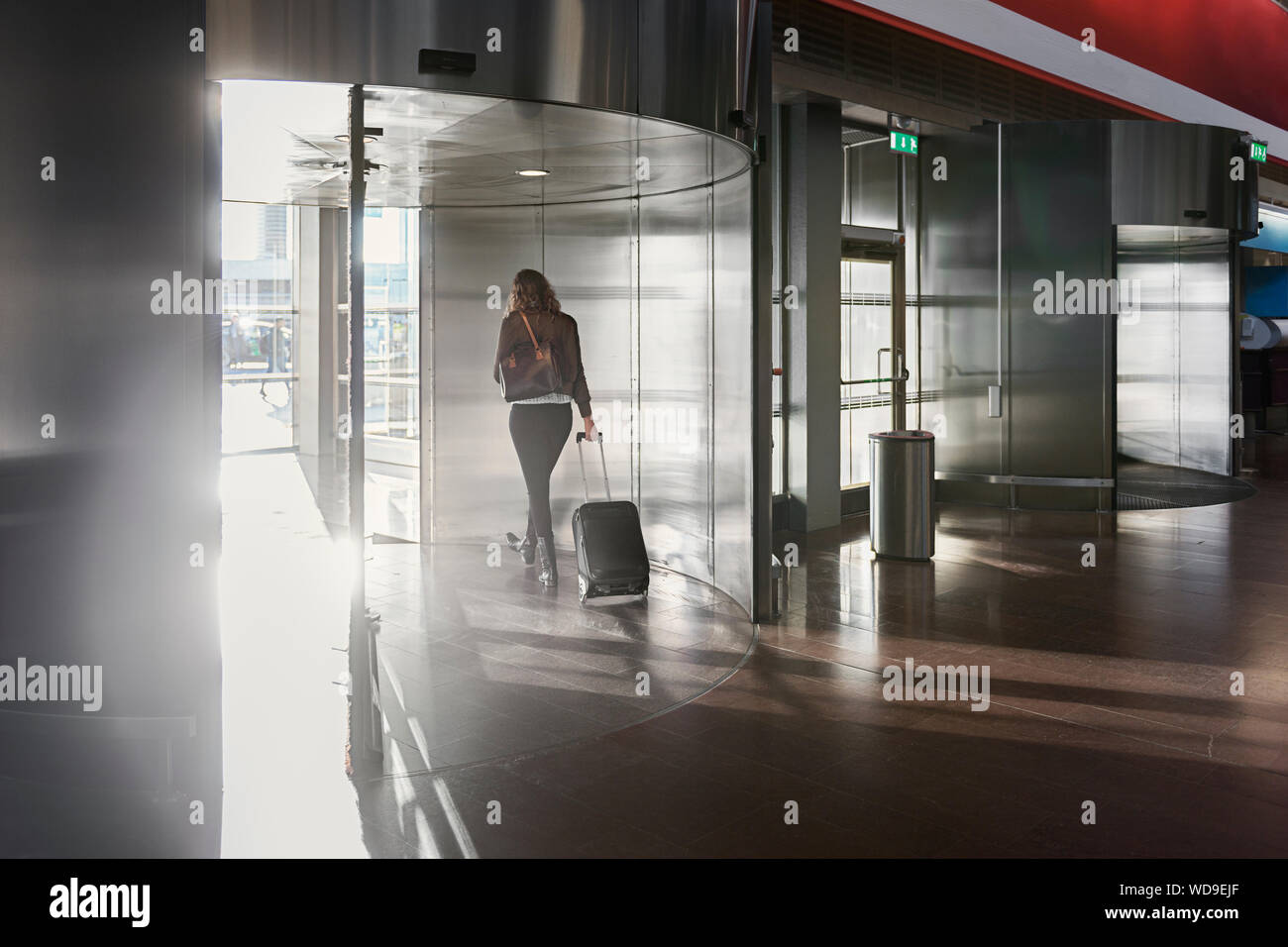 Person pulling suitcase hi-res stock photography and images - Alamy