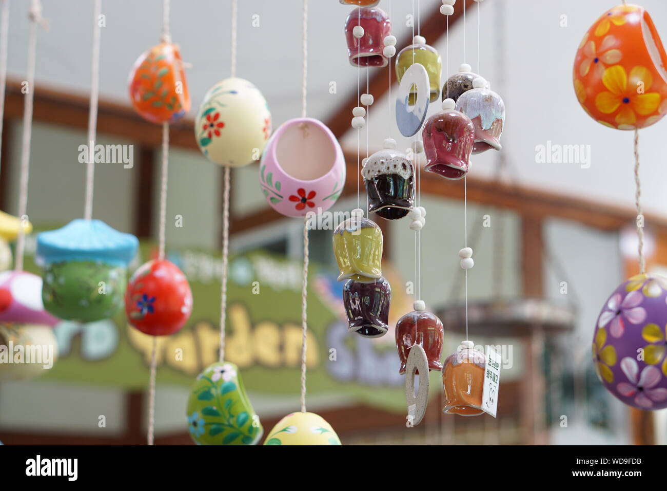 Multi colored wind chimes hi-res stock photography and images - Alamy