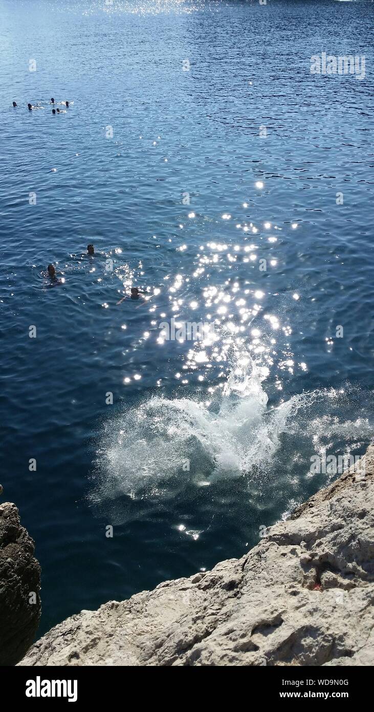 People splashing sea hi-res stock photography and images - Alamy