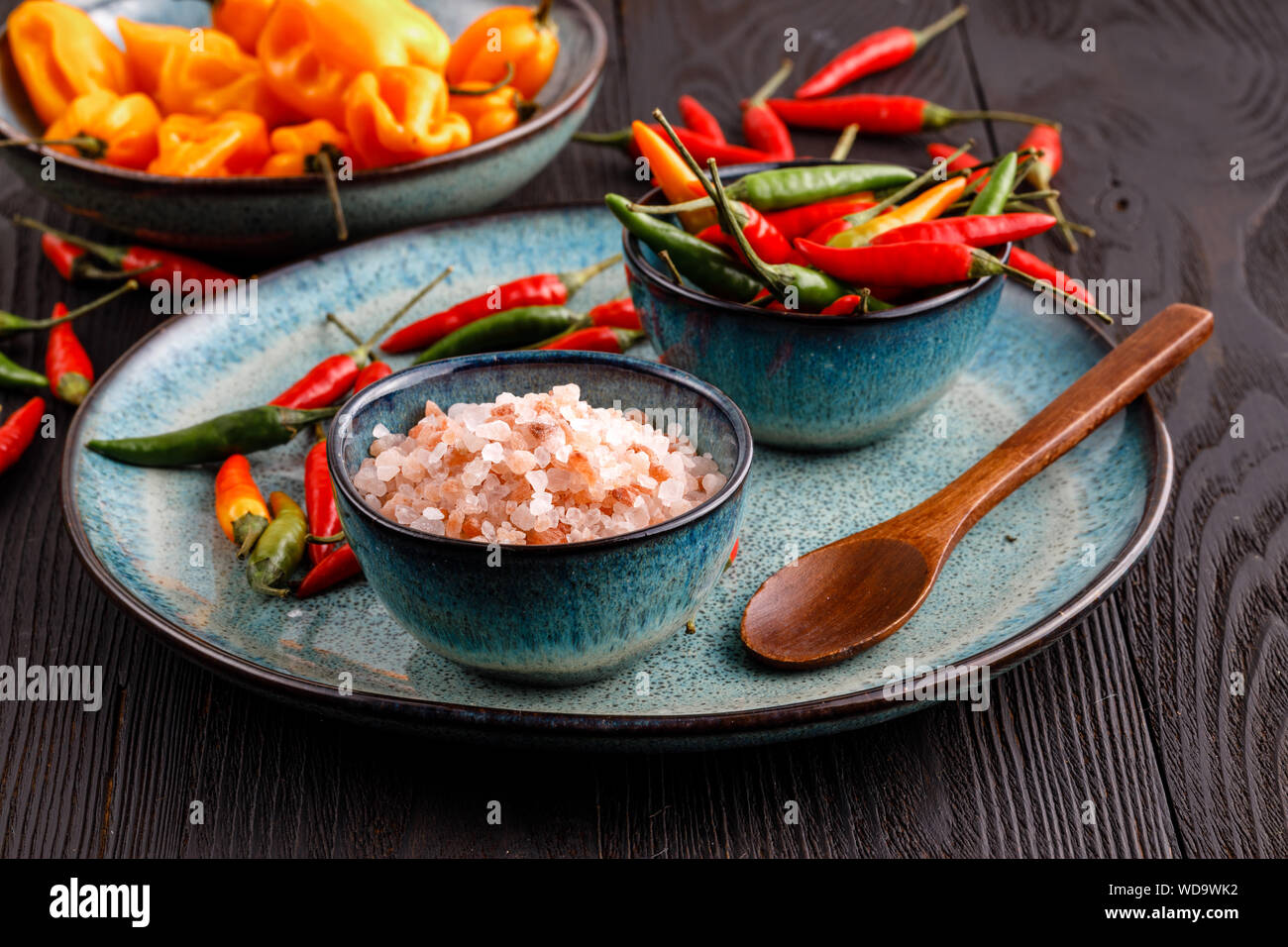 Composition with chili pepper and rose salt Stock Photo - Alamy