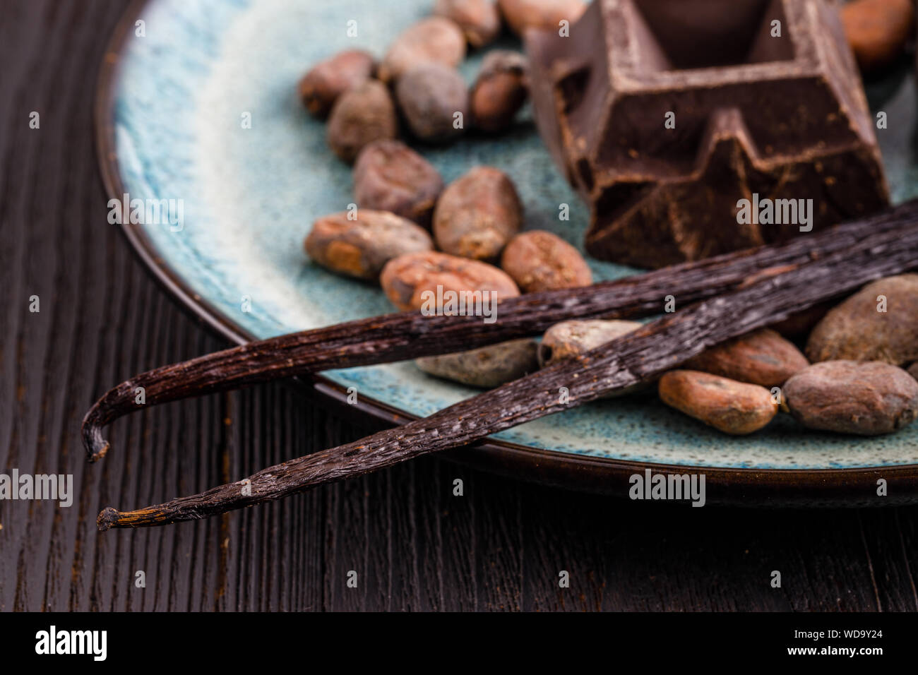 Close up choco beans, vanila stick and chocolate Stock Photo - Alamy