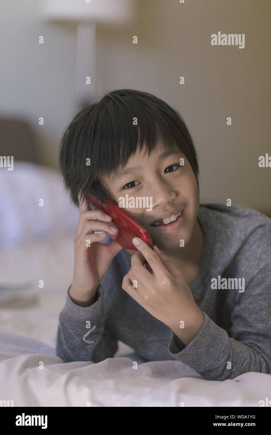 Indian boy talking on mobile hi-res stock photography and images - Alamy