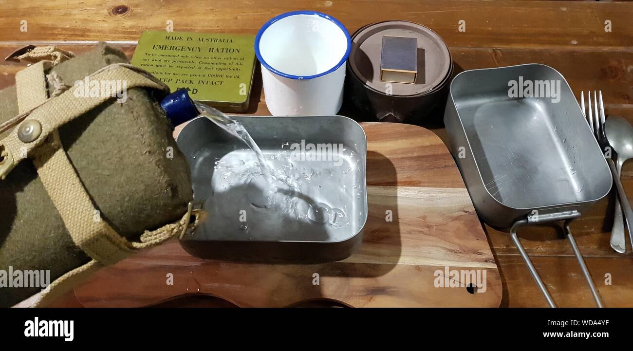 Pouring water into the mess tin to prepare the ration Stock Photo - Alamy