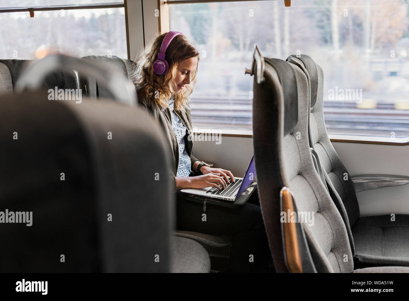 Woman with headphones train hi-res stock photography and images - Alamy