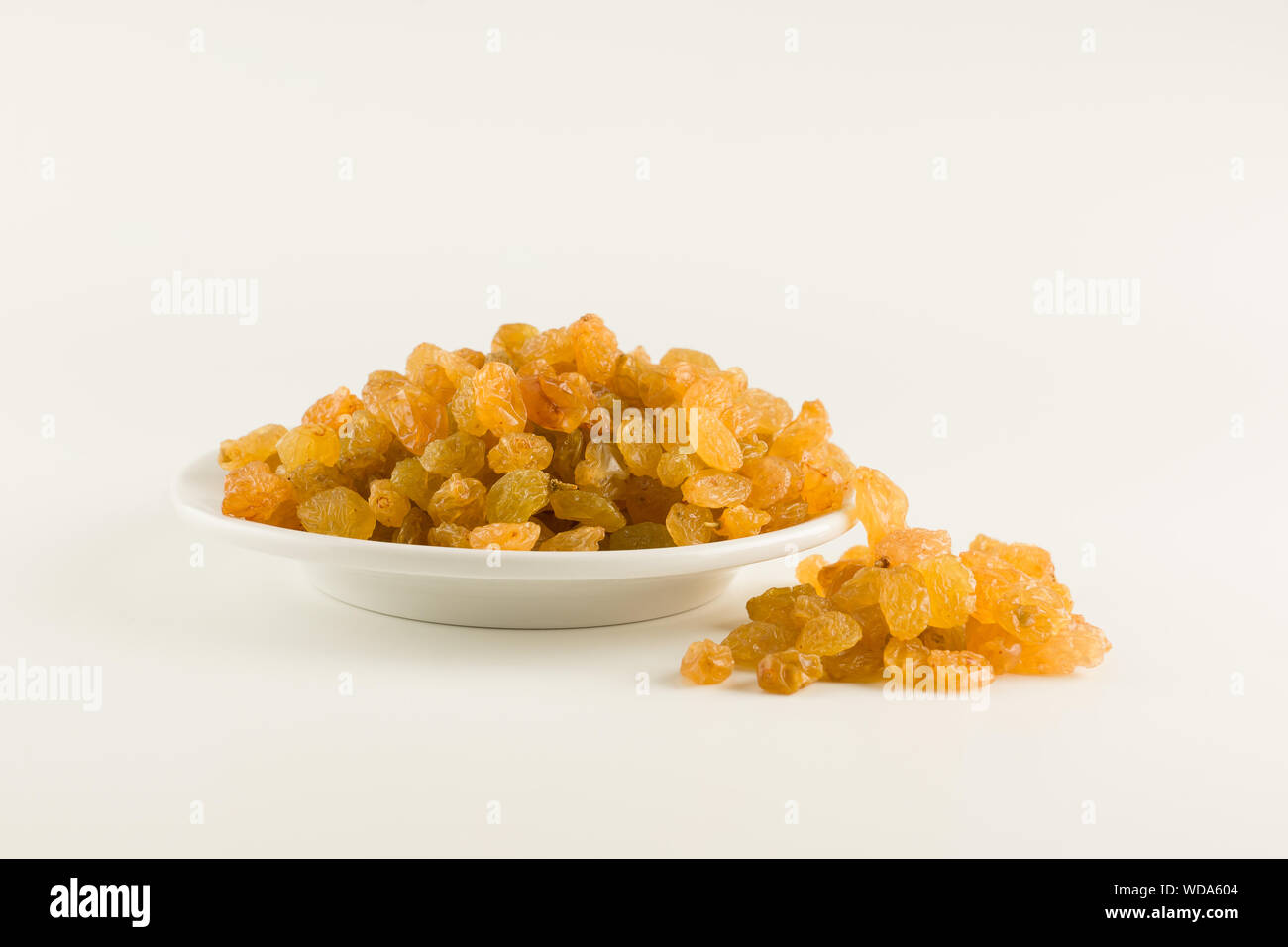 Fresh picked raisins isolated on white background and ready to eat ...