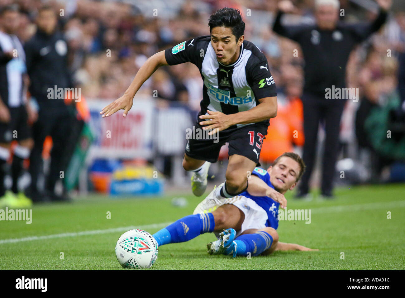 Dennis Praet of Leicester City tackles Yoshinori Muto of Newcastle ...