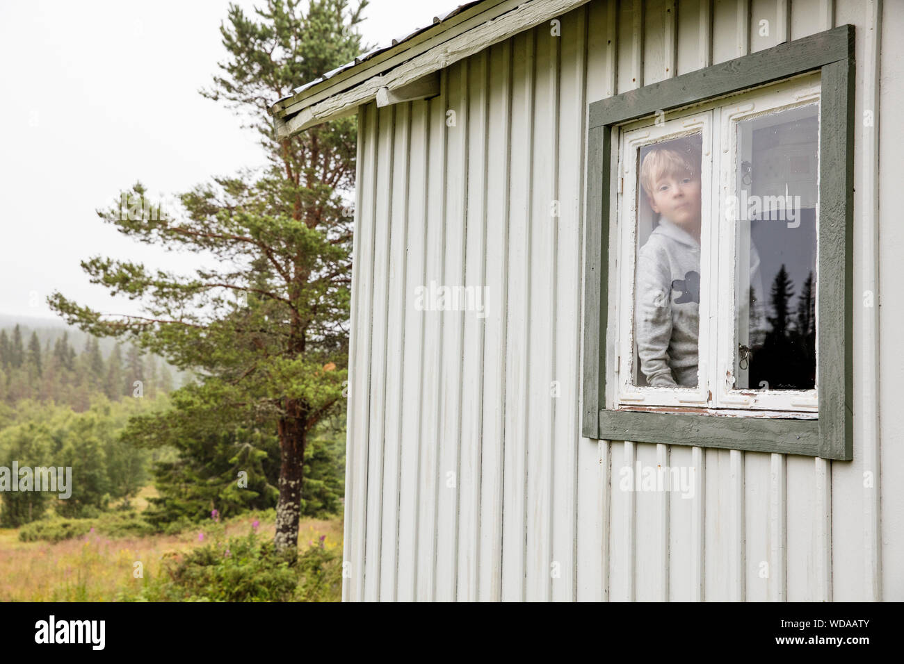 Boy at house hi-res stock photography and images - Alamy