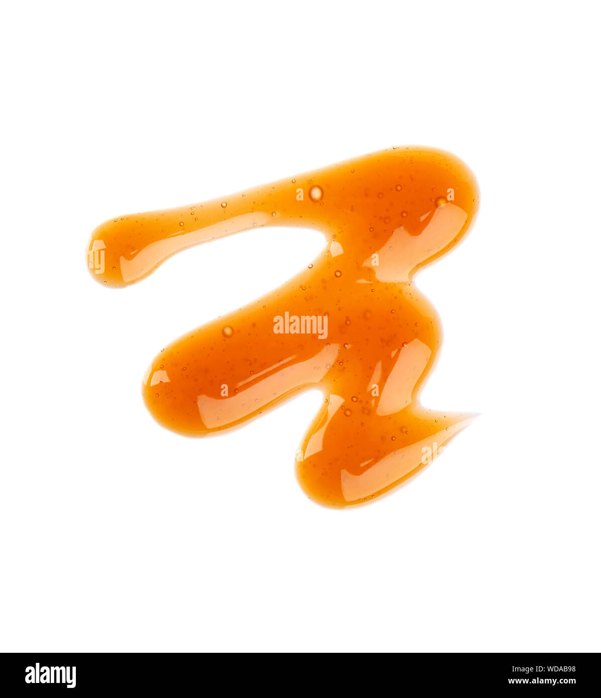 Caramel Syrup Drizzle Isolated On White Background Splashes Of Sweet