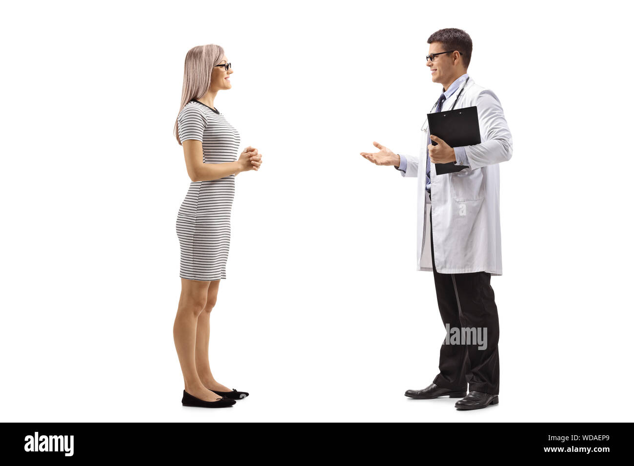 Full length profile shot of a female patient and a doctor talking ...
