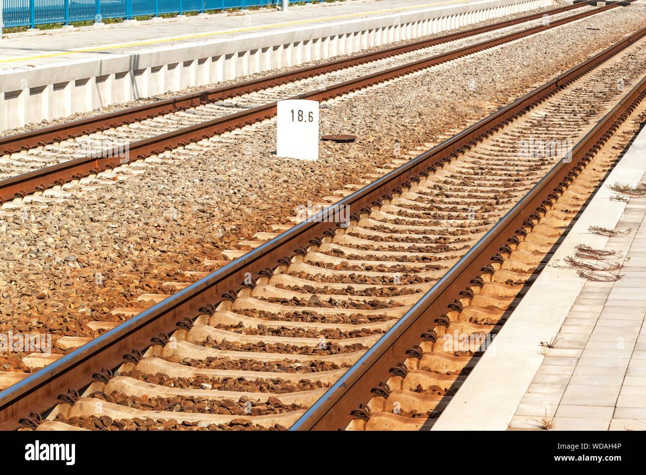 Train on platform in station in Czech Republic. Railroad tracks with ...