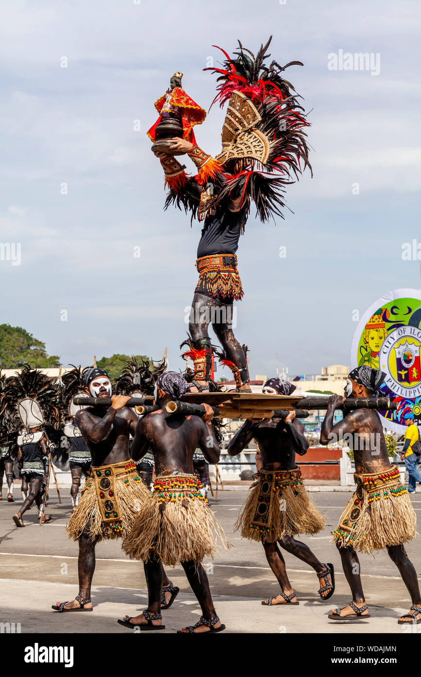 A Man Holds A Santo Nino Statue During The Tribal Dancing, Dinagyang ...