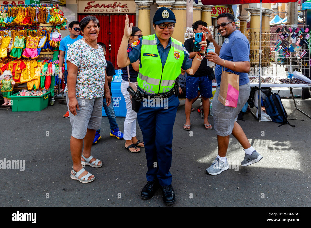 A Policewoman Dances In The Street With Festival Revellers During The ...