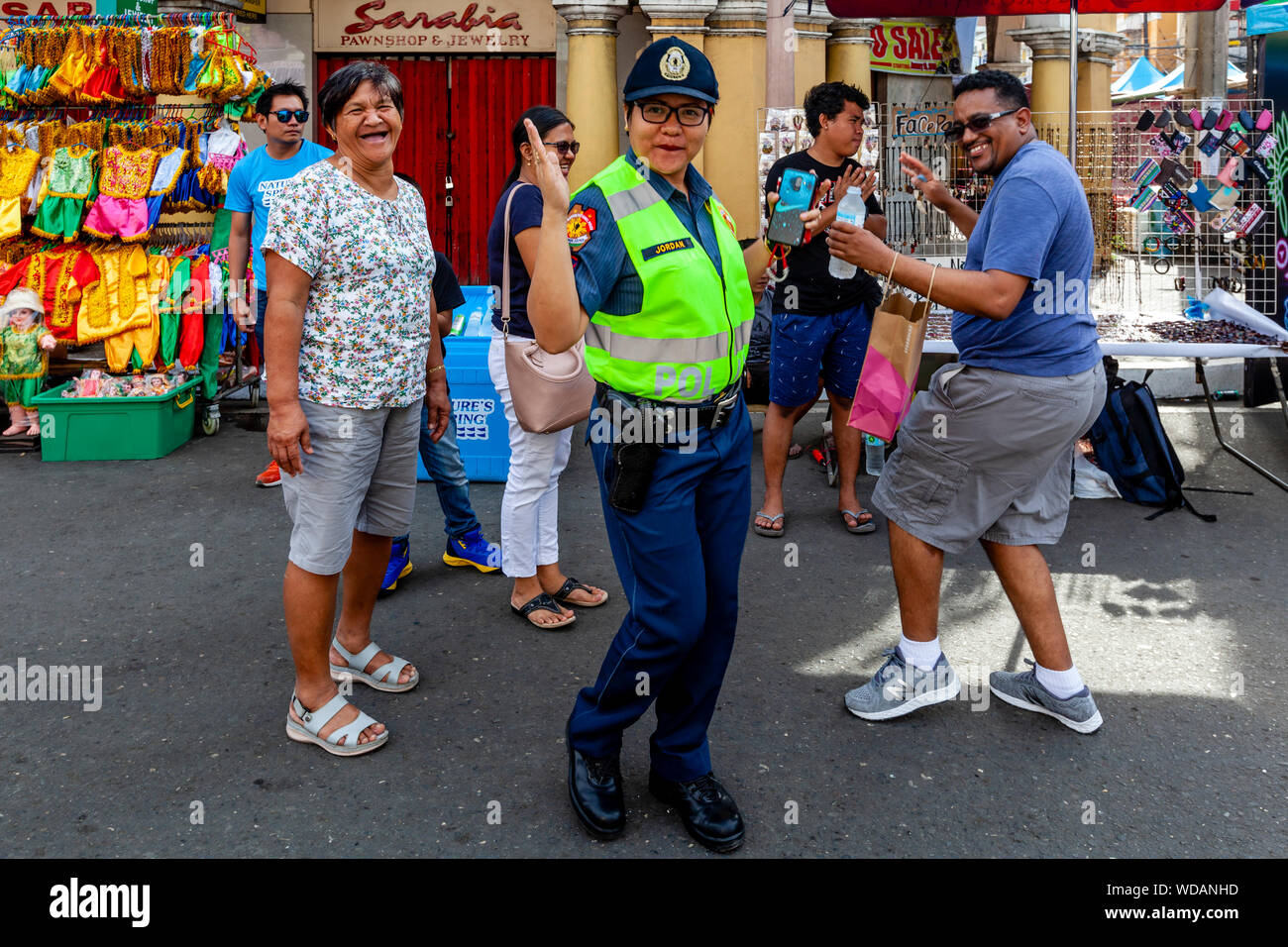 A Policewoman Dances In The Street With Festival Revellers During The ...
