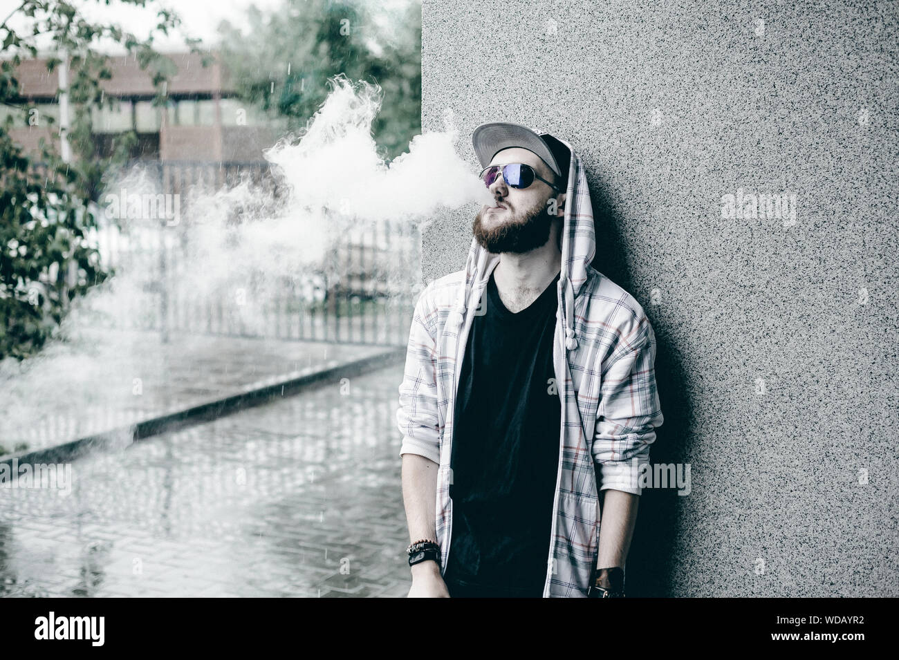 Rainy Day Man Smoking High Resolution Stock Photography and Images - Alamy