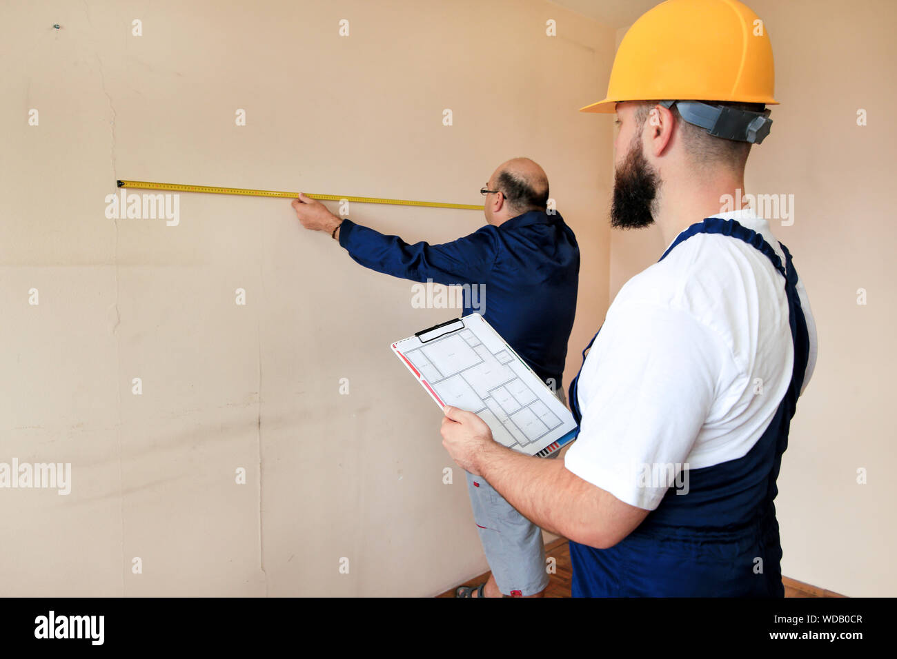 Engineer, contractor and project manager with his colleague ...