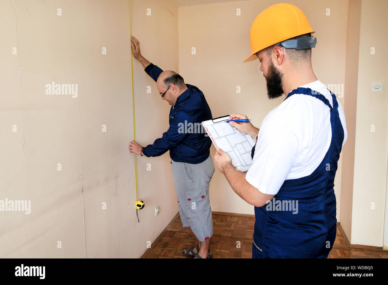 Engineer, contractor and project manager with his colleague ...