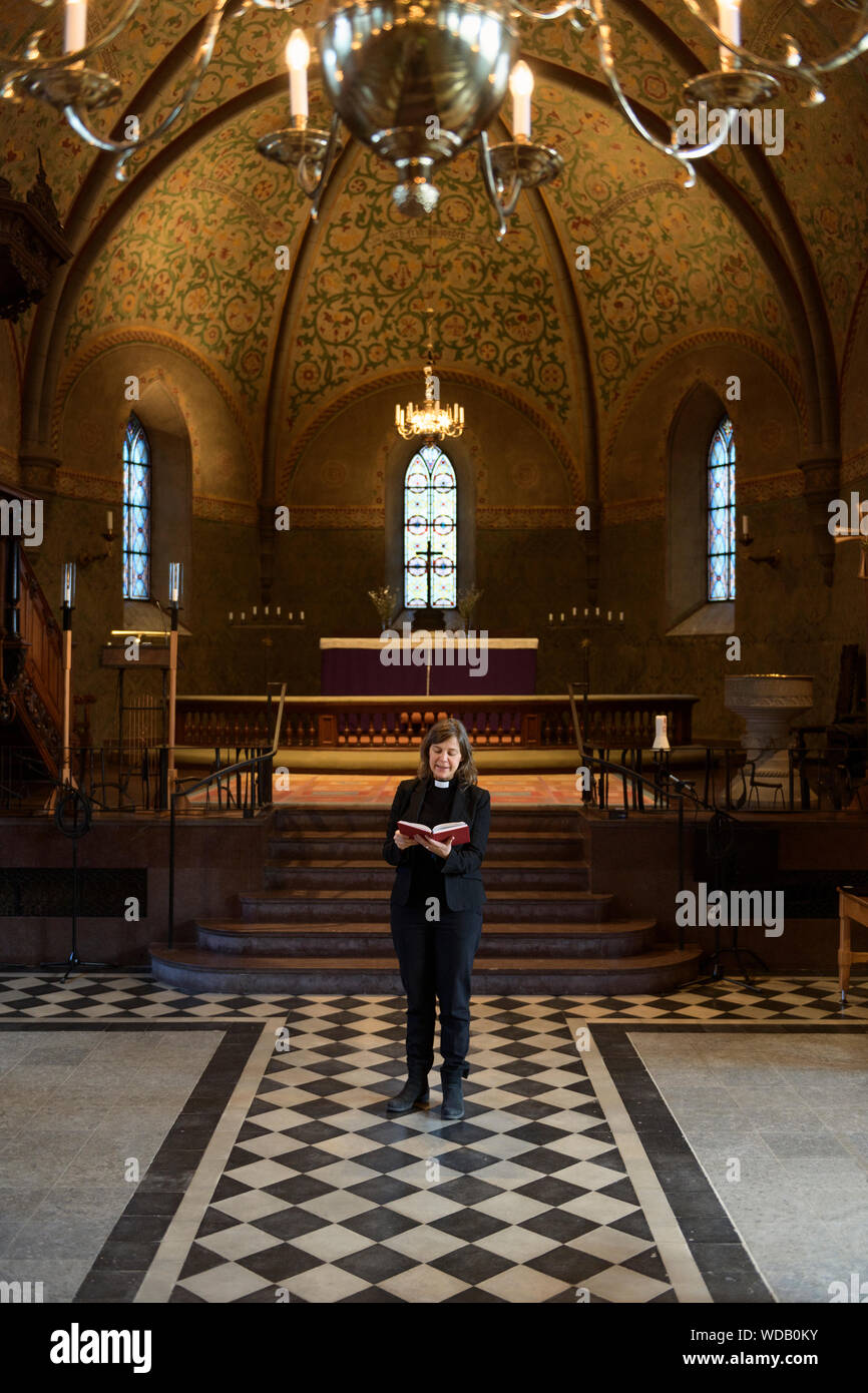 Priest reading bible hi-res stock photography and images - Alamy