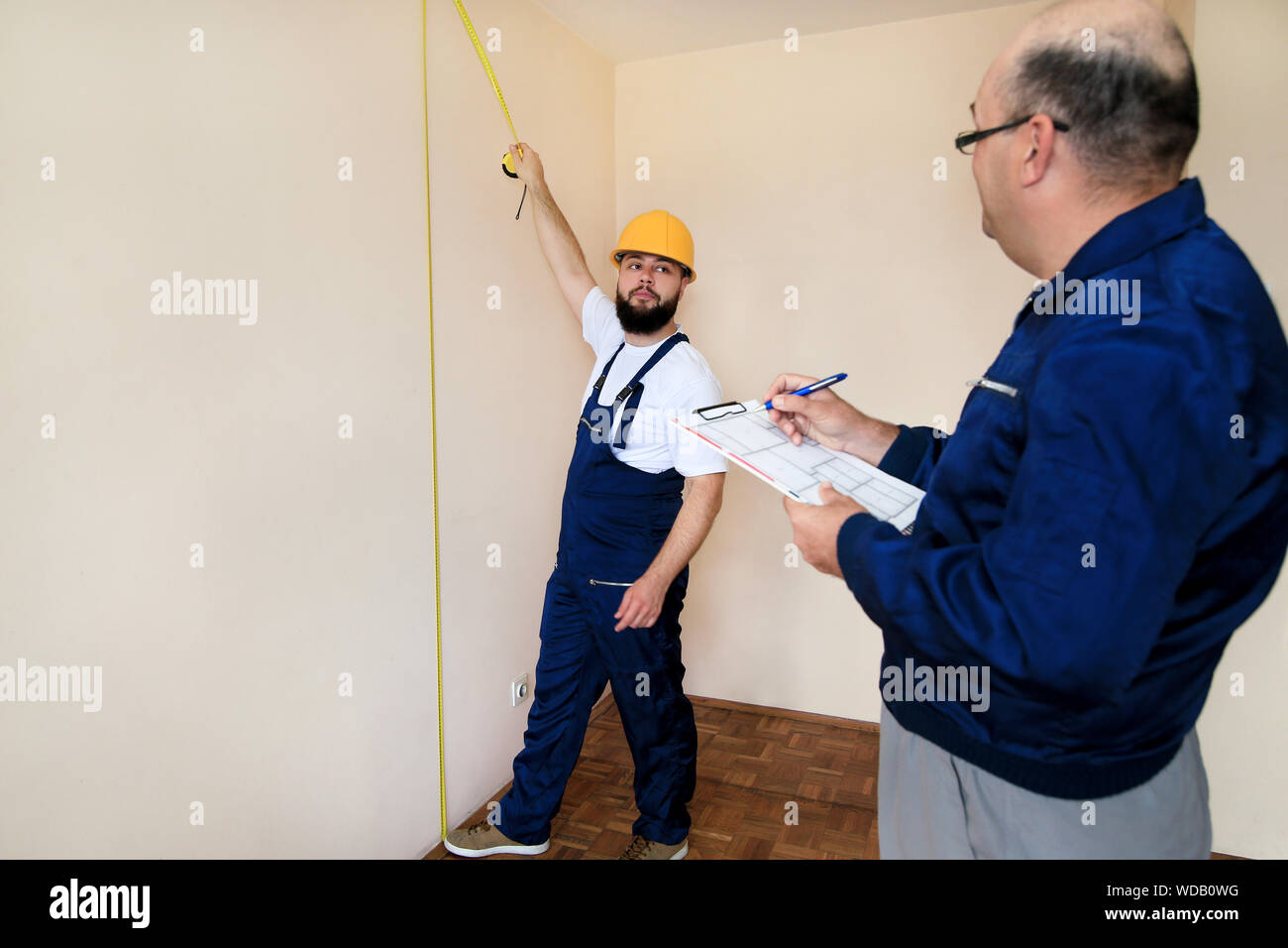 Engineer, contractor and project manager with his colleague ...