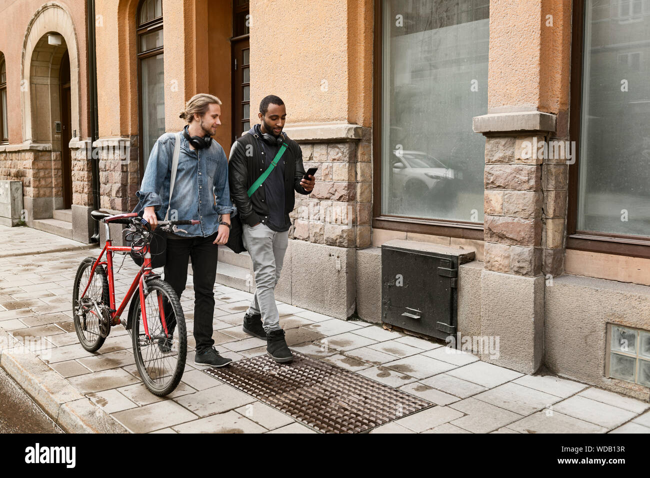 Two young men walking on hi-res stock photography and images - Alamy