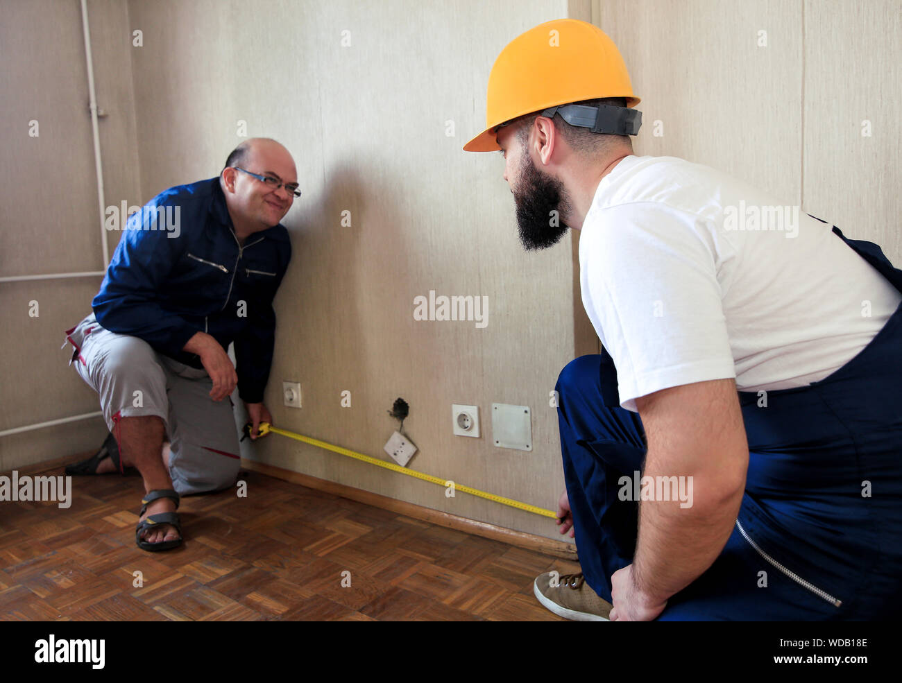 Engineer, contractor and project manager with his colleague ...