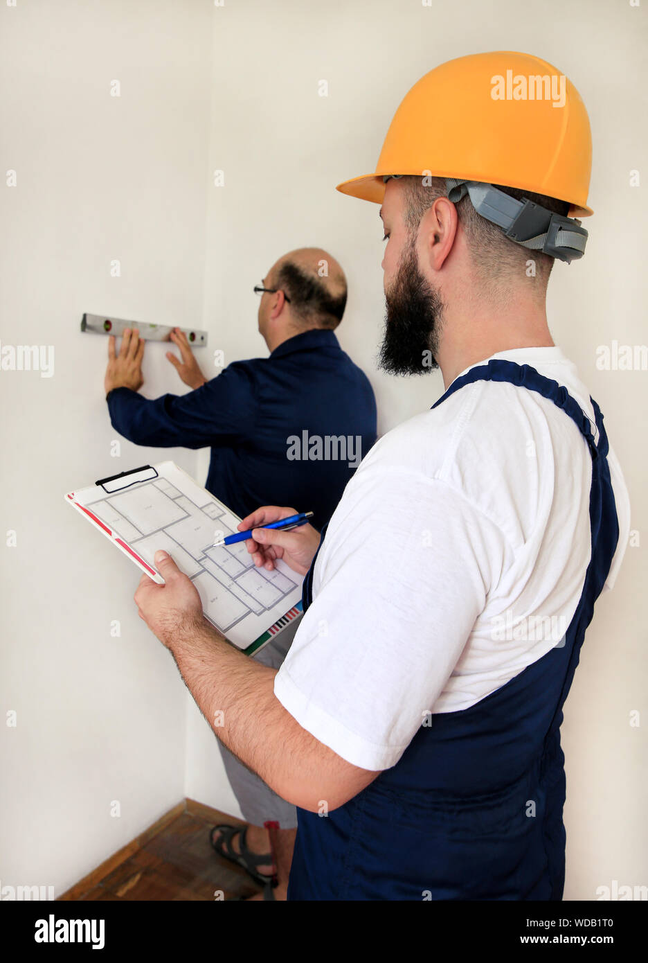 Engineer, contractor and project manager with his colleague ...