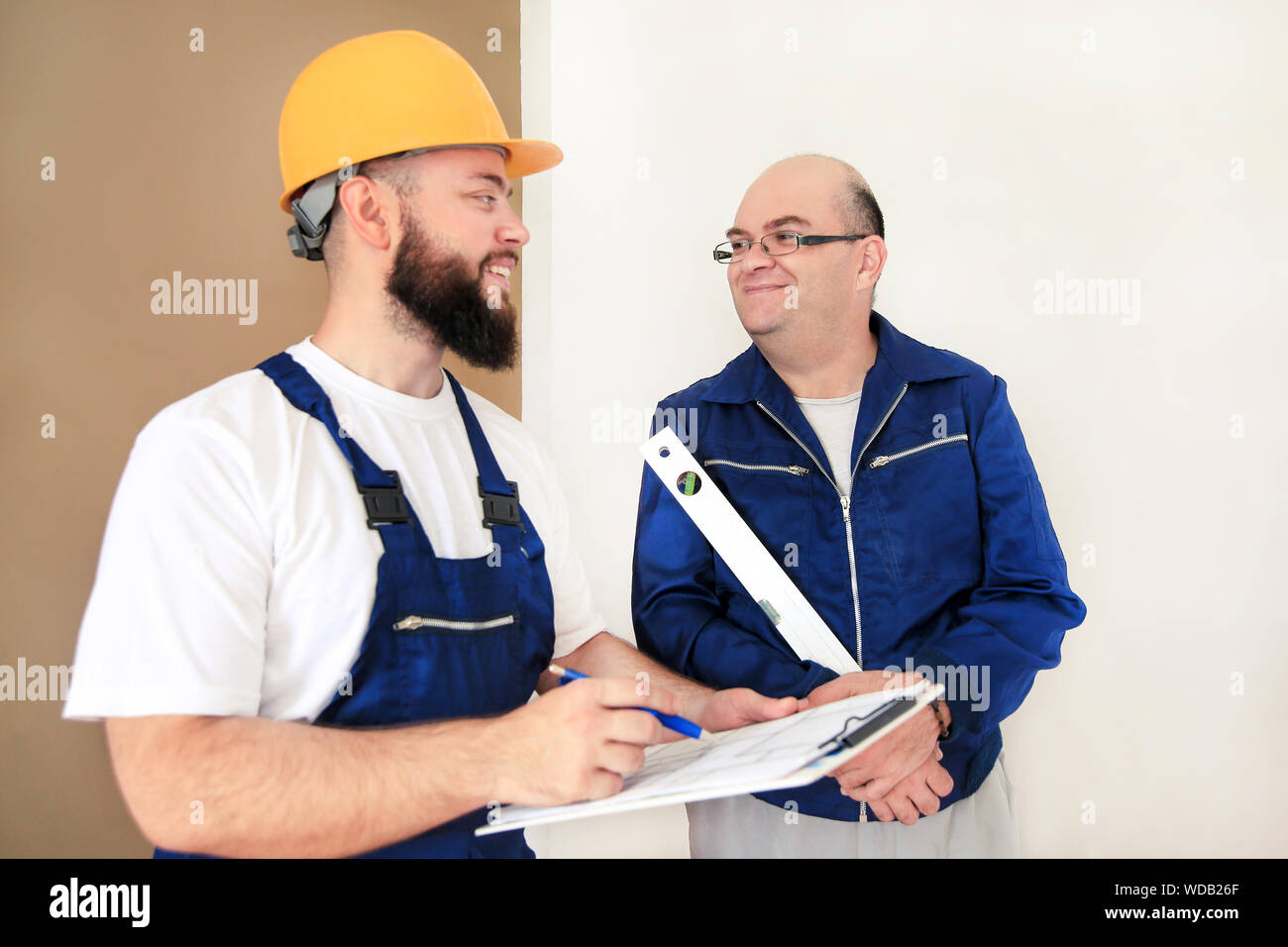 Engineer, contractor and project manager with his colleague ...