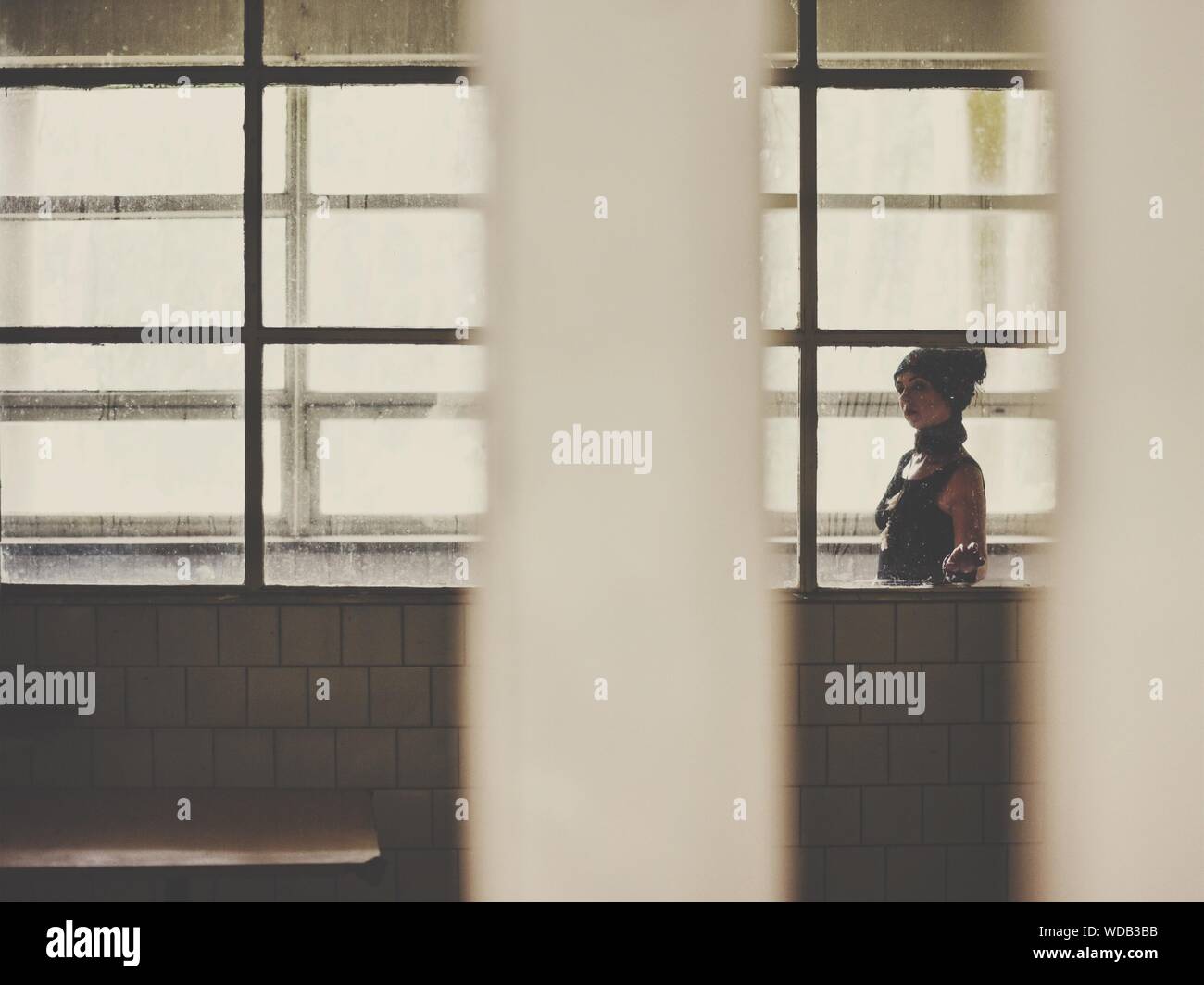 Stylish Woman Seen Through Window Stock Photo - Alamy